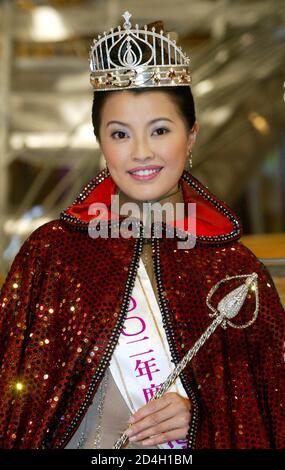 The winner of Miss Hong Kong Pageant 2014 Veronica Shiu (C) poses with ...
