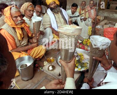 Hindu priests pour milk on top of deities Lord Jagannath, Balabhadra ...