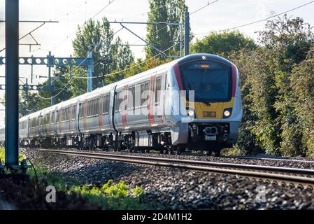 British Rail Class 720 Aventra train of Greater Anglia passing Hawkwell, Rochford, near Southend ...