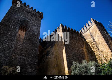 Stone towers with large wall in Romanesque style over the hill at Avila ...