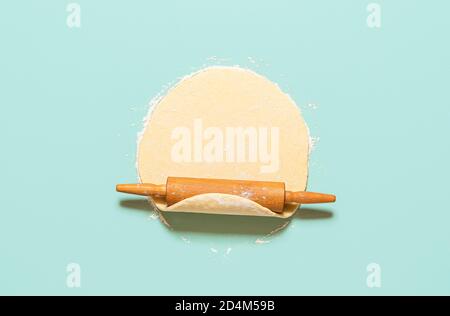 Step by step. Flat lay. Rolling out Sugar cookie dough with French ...