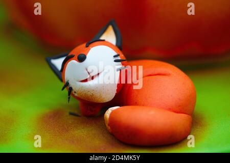 Fox figures made of sugar dough. delicious orange-colored confections ...