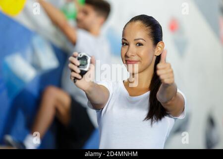 trainer showing the stop watch Stock Photo - Alamy