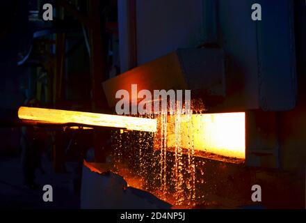 Steel quenching at high temperature in industrial furnace at the ...