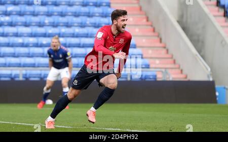 Morecambe's Cole Stockton celebrates scoring their side's first goal of ...