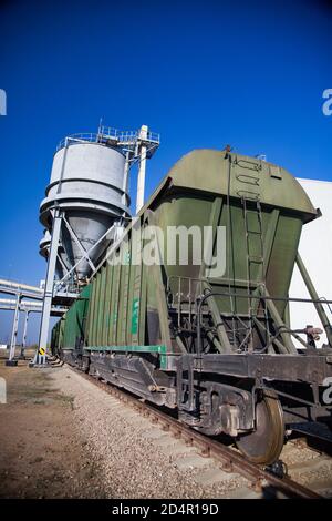 Hopper car railroad terminal. Phosphate fertilizers plant. Wagon wheel ...