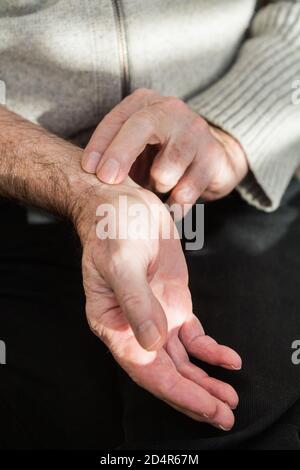 Man checking pulse close up Stock Photo - Alamy