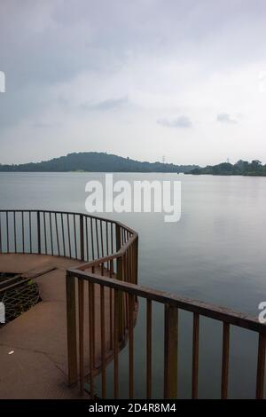 Pleasant view of Amthane Dam reservoir on an overcast day during ...