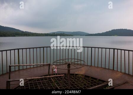 Pleasant view of Amthane Dam reservoir on an overcast day during ...