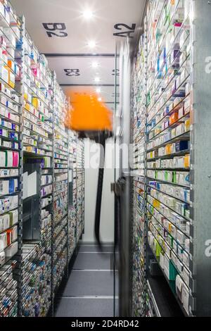 Pharmacy equiped with a robot able to manage drugs stock, from storing ...