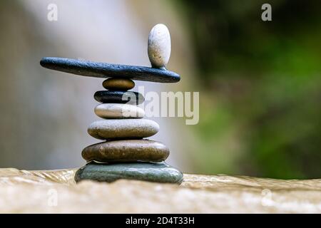 Balanced Zen stones pebbles at the waterfalls Stock Photo - Alamy