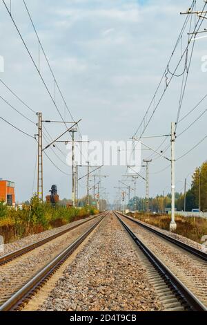 Two lane railroad with electric power lines Stock Photo - Alamy