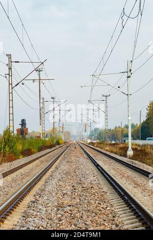 Two lane railroad with electric power lines Stock Photo - Alamy