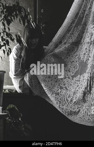 Demon possessed little girl at night. Mad scary girl at dark night ...