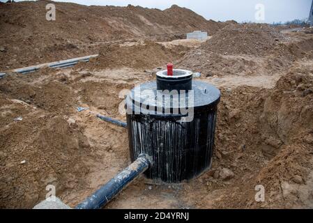 Connecting a trench drain to a concrete manhole structure at ...