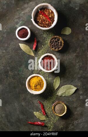 Colorful ground spicy chili peppers , pimento and curcuma powder for ...