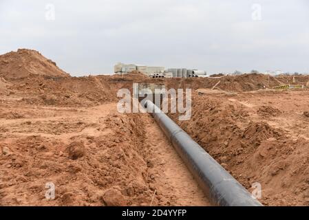 Connecting a trench drain to a concrete manhole structure at ...