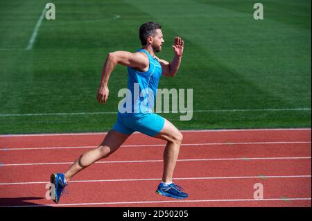 Great progress. muscular guy run to success. man running on stadium ...
