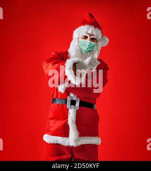 Santa Claus with Covid-19, wearing protective face mask. Christmas 2020 ...
