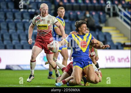 Anthony Gelling of Warrington Wolves brought down by Sam Powell and Joe ...