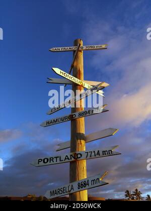 Vertical shot of different signs on the beach Stock Photo - Alamy