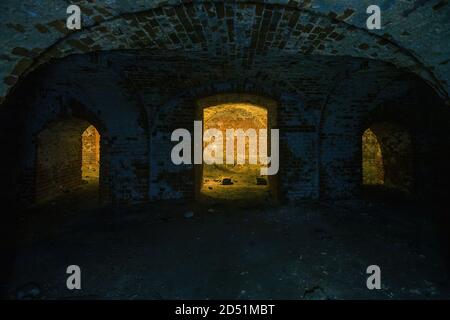 Dark and creepy vaulted red brick dungeon Stock Photo - Alamy