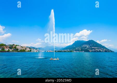 Fountain at Lugano lake and Lugano city panoramic view in canton of ...