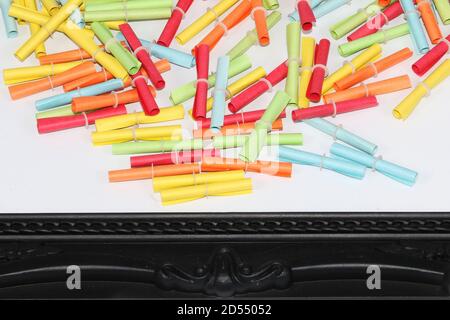 Closeup shot of colorful raffle tickets in an old black picture frame ...