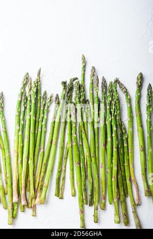 Bunch of green asparagus on concrete background Stock Photo - Alamy