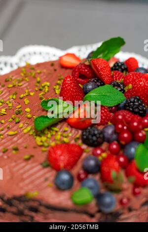 Closeup shot of a birthday cake with berries and candles on it Stock ...