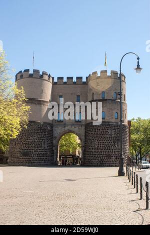 Medieval city gate with two round towers, part of the old city defense ...