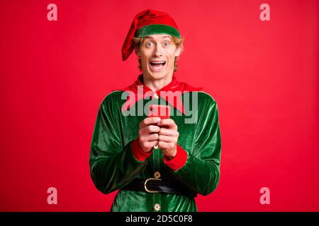 Photo of amazed elf guy hold spoon fork x-mas christmas party feast ...