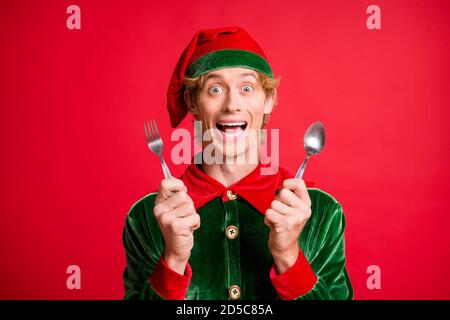 Photo of amazed elf guy hold spoon fork x-mas christmas party feast ...