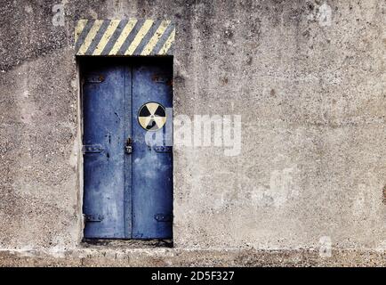 Mysterious padlocked reinforced steel door to a concrete nuclear bunker ...