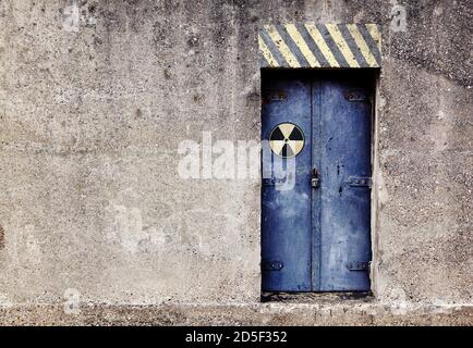 Mysterious padlocked reinforced steel door to a concrete nuclear bunker ...