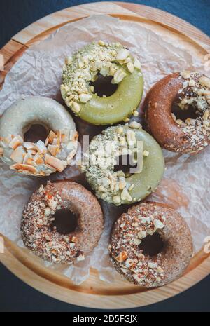 Wooden round table with coffee and desserts. Coffee break Stock Photo ...