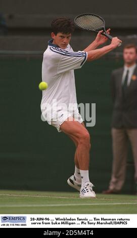 Tim Henman returns a serve from Nick Baglin Stock Photo - Alamy