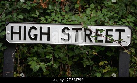 Traditional rural English road sign pointing toward Corfe Castle ...