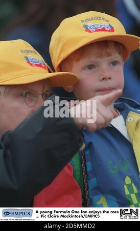 A young Formula One fan enjoys the race Stock Photo - Alamy