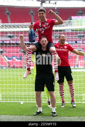 Barnsley's Ashley Fletcher celebrates on the shoulders of Head of ...