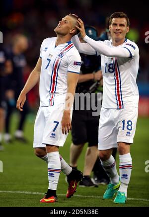 Iceland's Johann Berg Gudmundsson (left) and England's Wayne Rooney ...