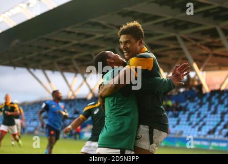 South Africa's Edwill van der Merwe, left, battles for the ball with ...