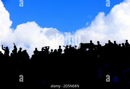 Fans are silhouetted against the sky in the stand during The Mind ...
