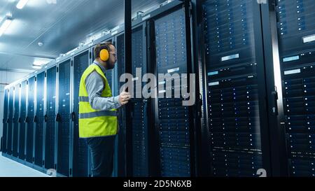 Computer Engineer Opening Server Rack Door In Data Center Stock Photo ...