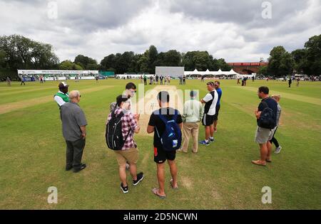 Spectators on the pitch during the lunch break Stock Photo - Alamy
