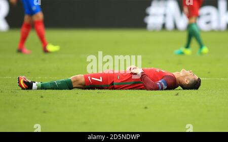 Portugal's Cristiano Ronaldo collapses to the ground injured early in ...