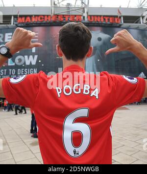Paul Pogba of Manchester United wearing a PP earring during warmup ...