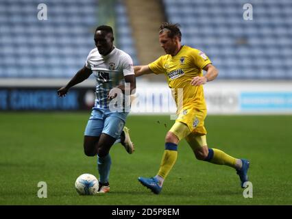 AFC Wimbledon's Dannie Bulman (left) and Accrington Stanley's Josh ...