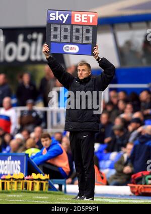 The fourth official holds up an electronic board signalling five ...