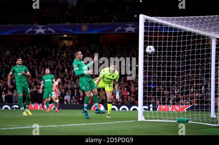 Arsenal's Alexis Sanchez (background) scores his side's first goal of ...